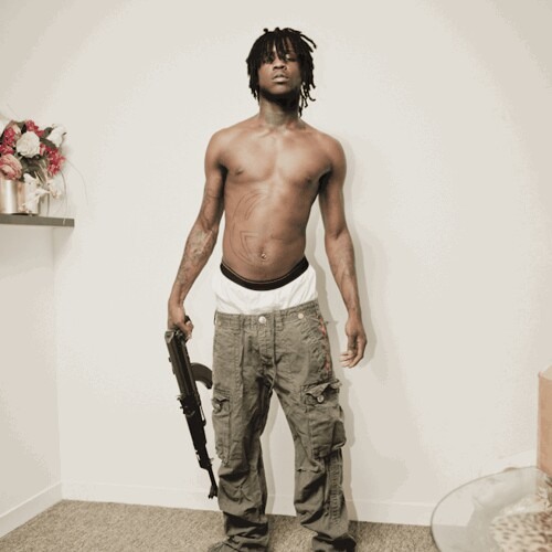 Chief Keef Holding A Rifle At A Gun Range
