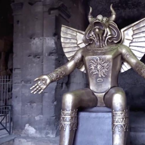 Stream The Vatican Places Giant Statue of Molech at Colosseum Entrance ...
