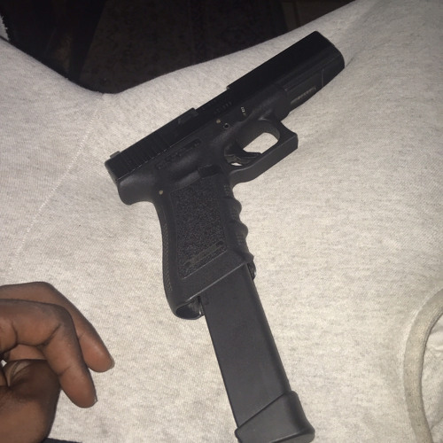 Money And Gun On Lap