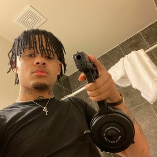 Chief Keef Holding A Rifle At A Gun Range